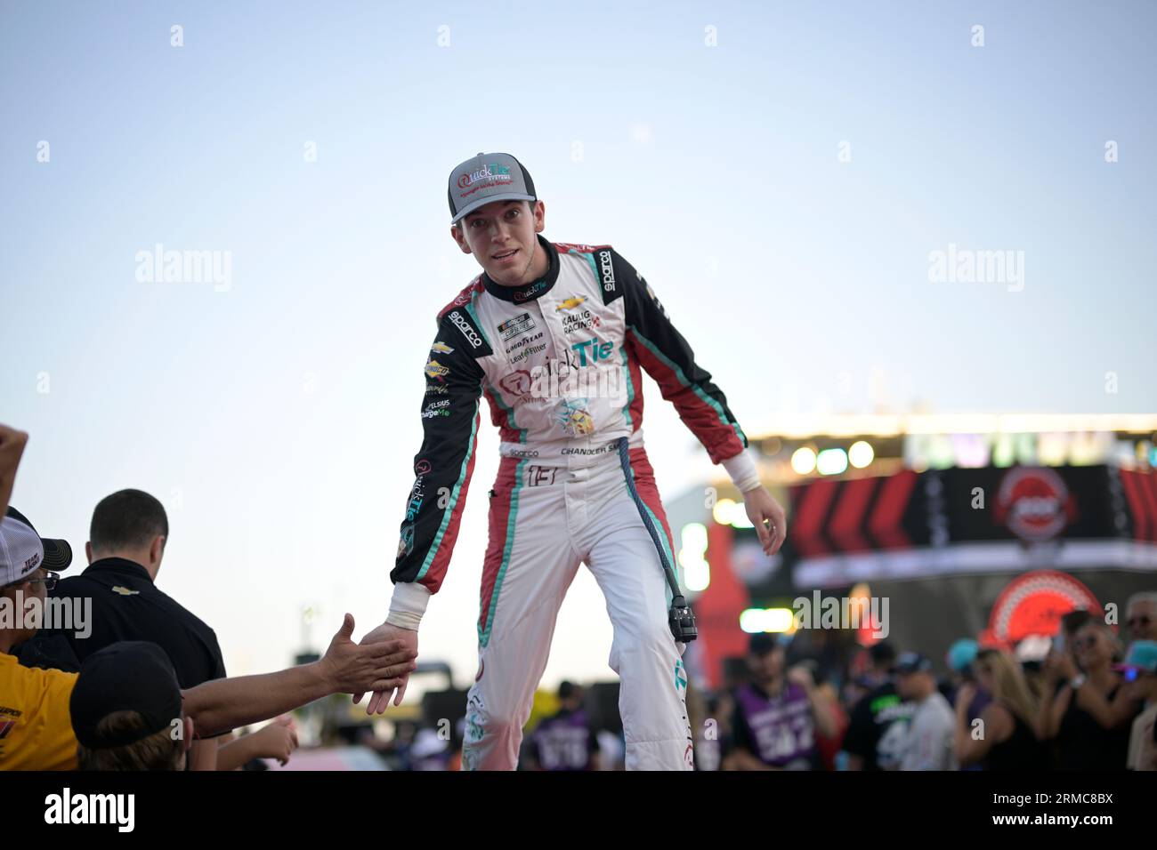 Chandler Smith slaps hands with spectators during driver introductions ...