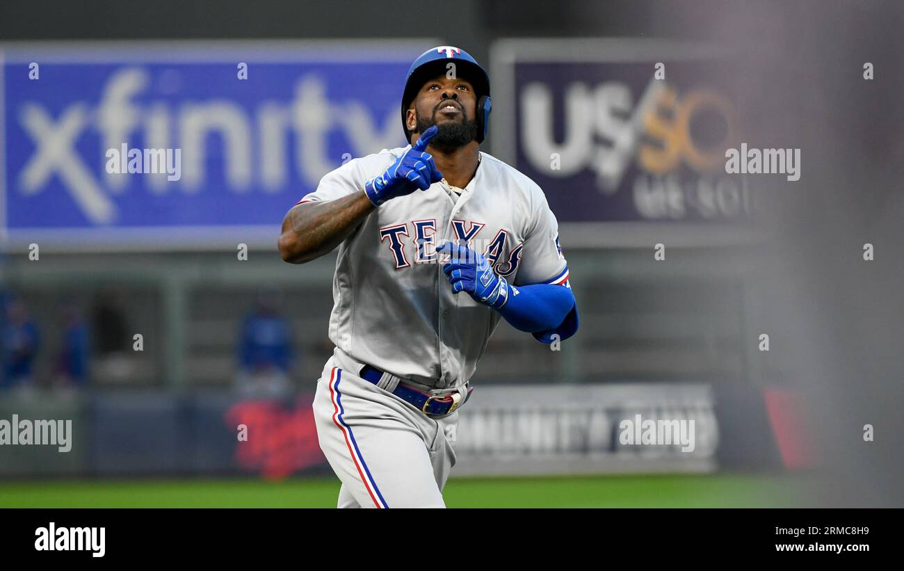 Texas Rangers' Adolis Garcia gestures as he crosses home plate after ...