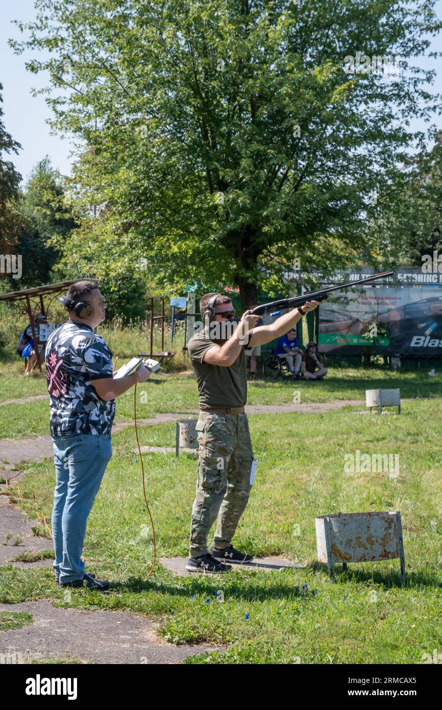 Lviv, Ukraine. 26th Aug, 2023. A military man stands with a rifle in ...