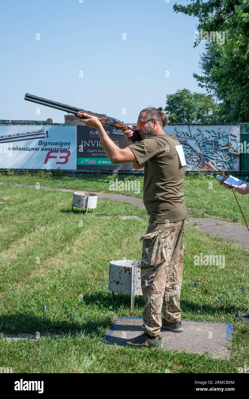 Lviv, Ukraine. 26th Aug, 2023. A military man stands with a rifle in ...