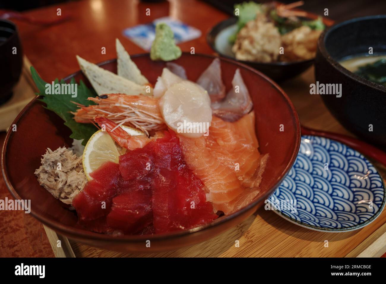Top view of Sashimi Don, Danburi or Japanese rice bowl with various raw ...