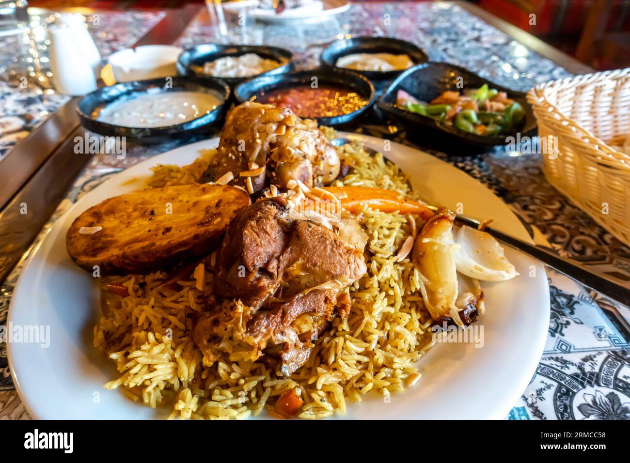Mandi lamb with rice - Jordanian dish on the table. Nabataean Tent ...