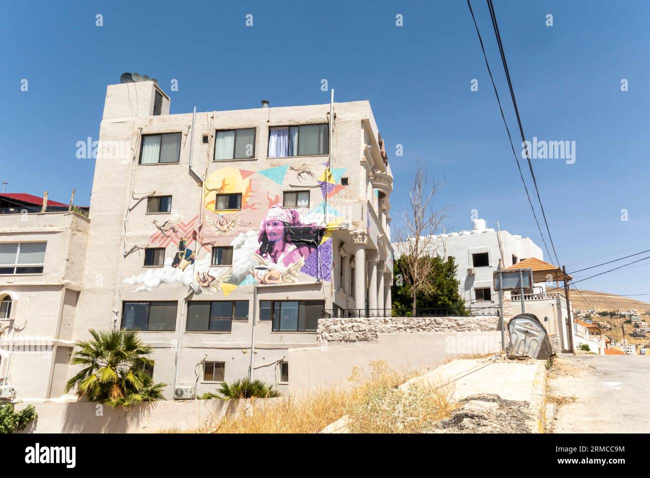 Side wall of a building covered with graffiti artwork, mural with ...