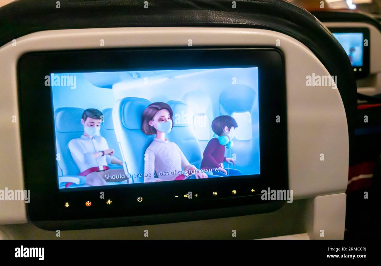 Personal television, PTV in front of an airplane seat showing instructions on Turkish Airlines ...