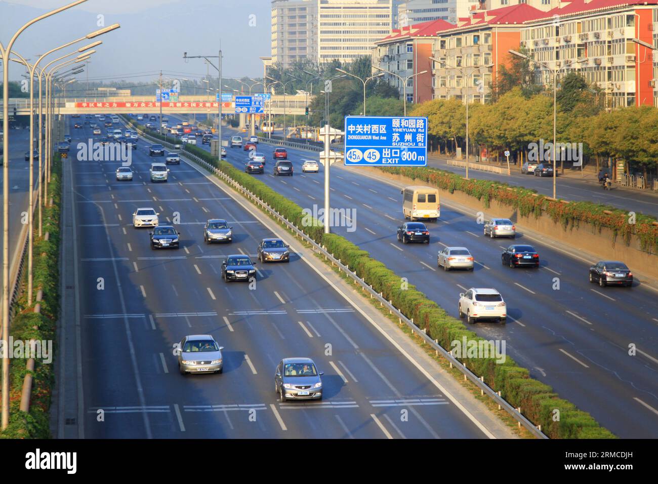 busy traffic flow in a modern city in the morning, in Beijing, China ...