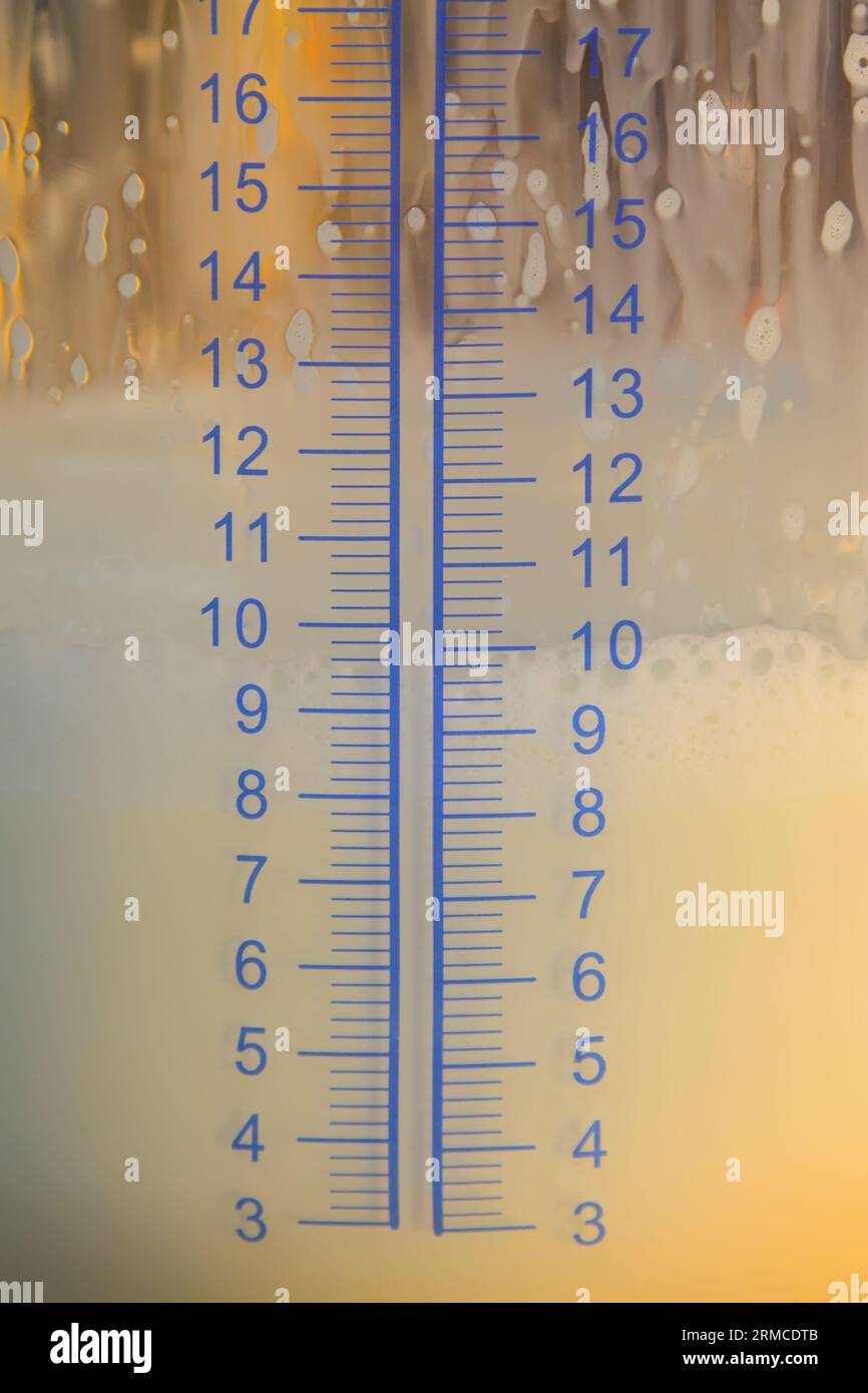 Ml scale on a glass milk storage tank, closeup of photo Stock Photo - Alamy