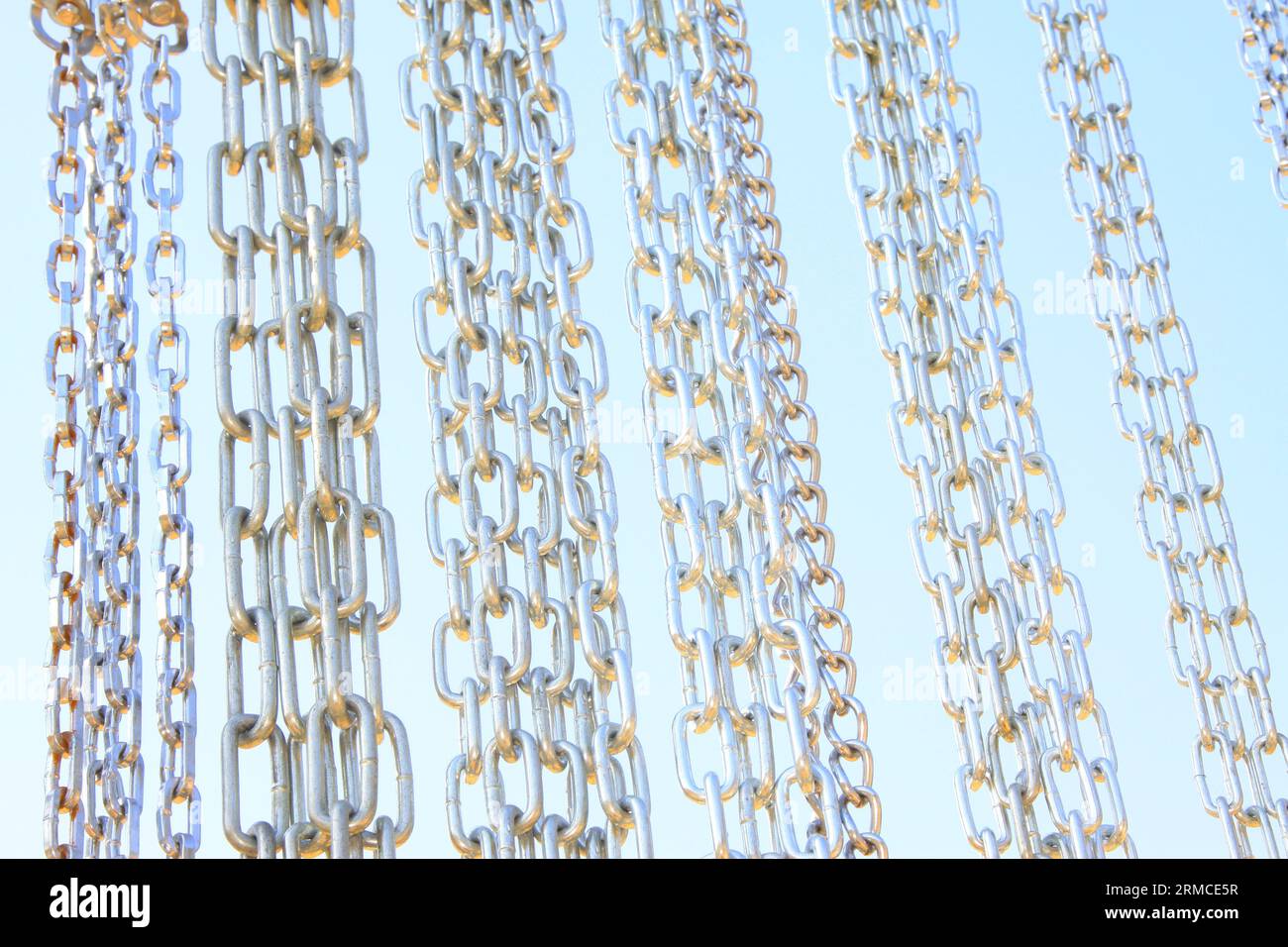 Stainless steel chains on blue sky background, in a market Stock Photo ...
