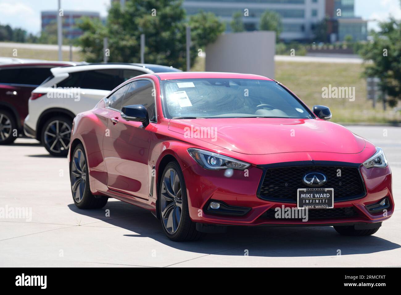 An unsold 2023 Q60 luxury coupe sits outside at an Infiniti dealership ...