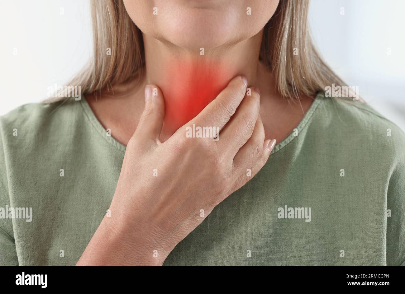 Endocrine system. Woman doing thyroid self examination, closeup Stock ...