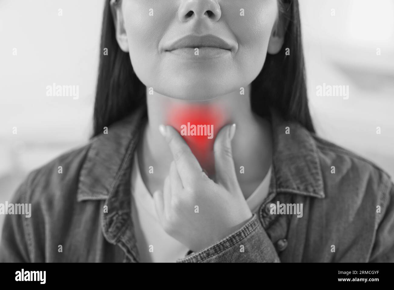 Endocrine system. Woman doing thyroid self examination, closeup. Color ...