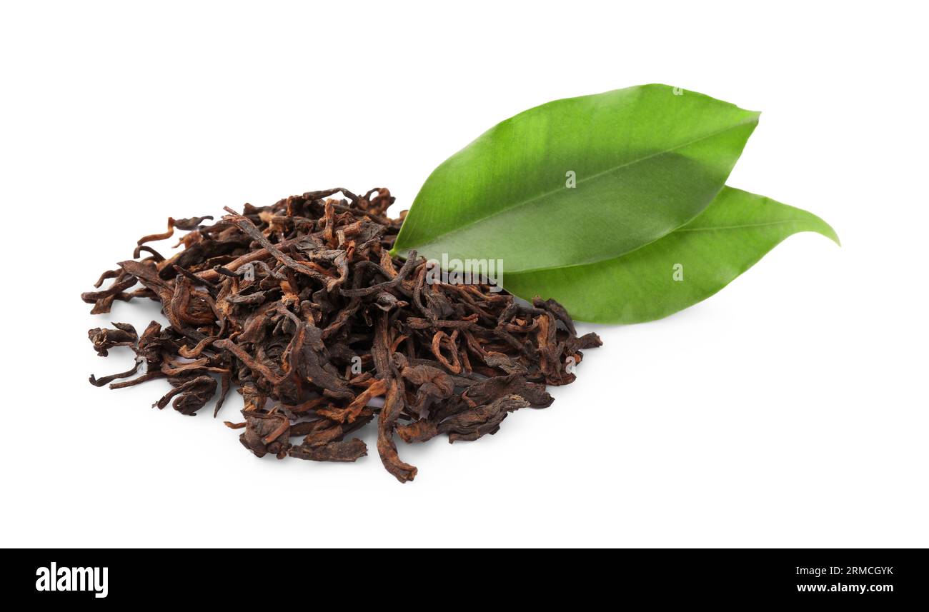 Pile of Traditional Chinese pu-erh tea and fresh leaves isolated on ...