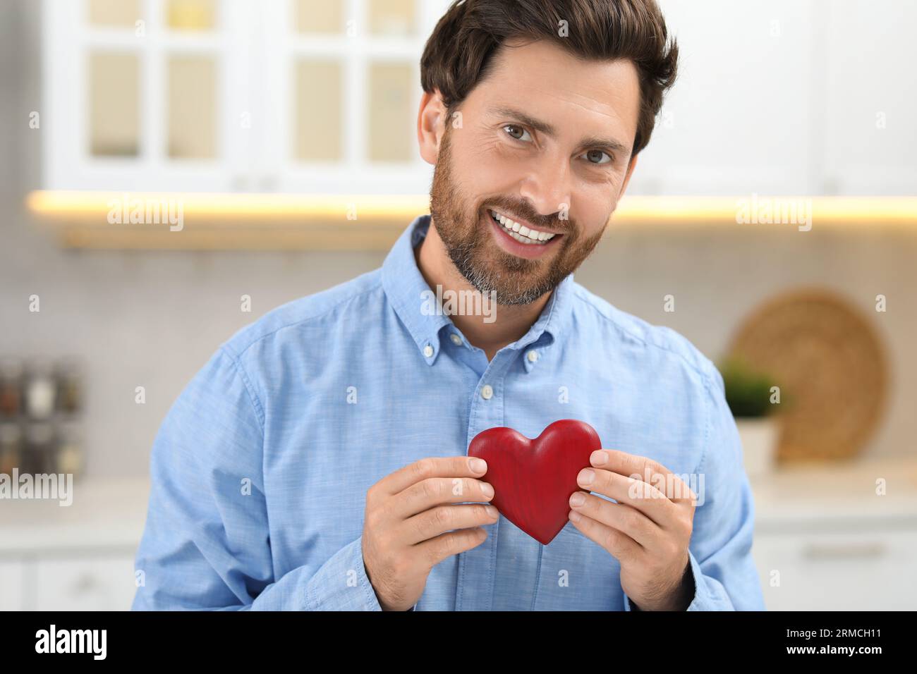 Care heart bearded man hi-res stock photography and images - Alamy