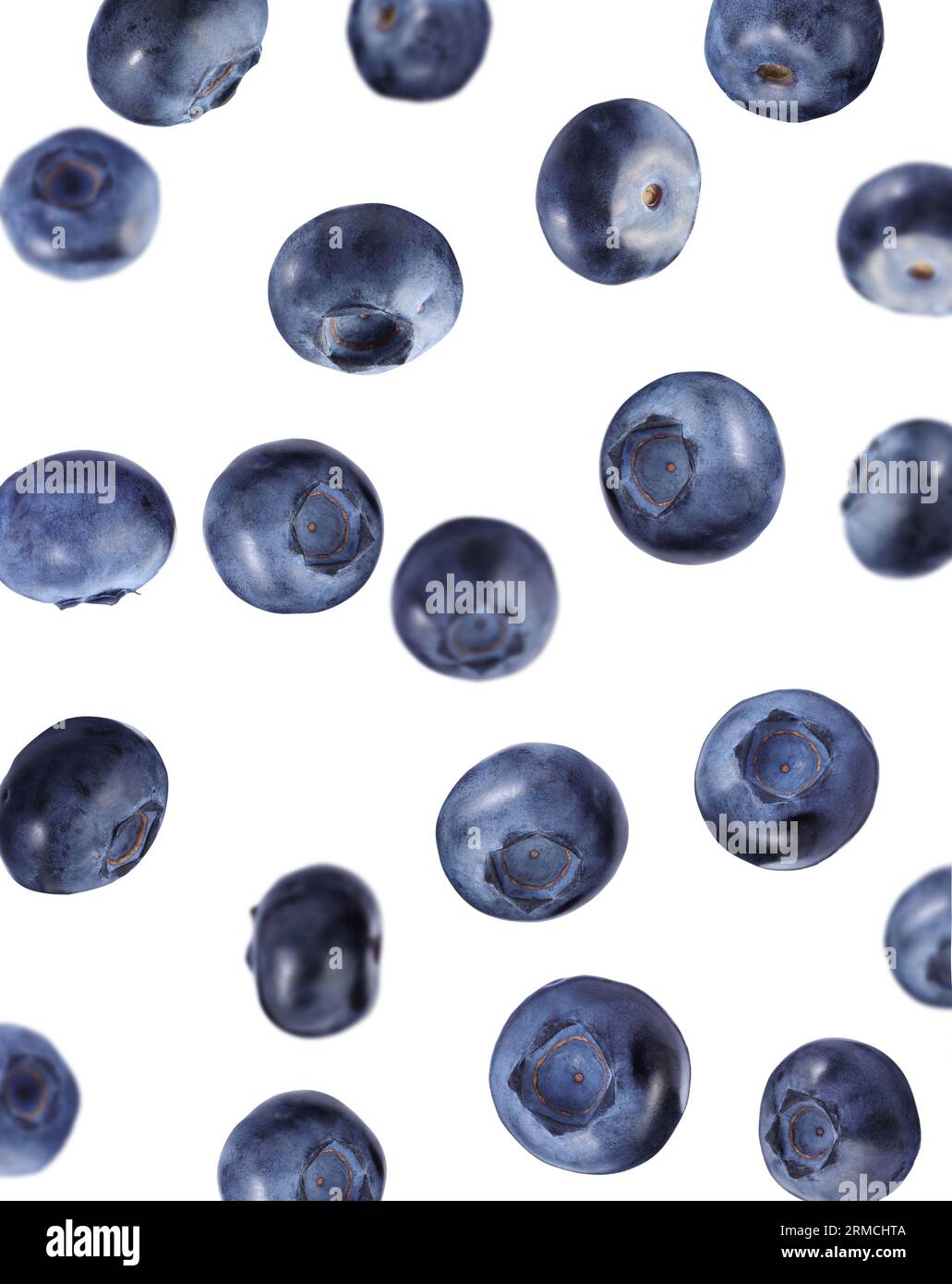 Many ripe blueberries falling on white background Stock Photo - Alamy