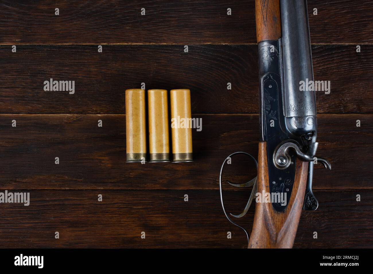 Antique 12-gauge break-action smooth-bored shotgun with paper cases on ...