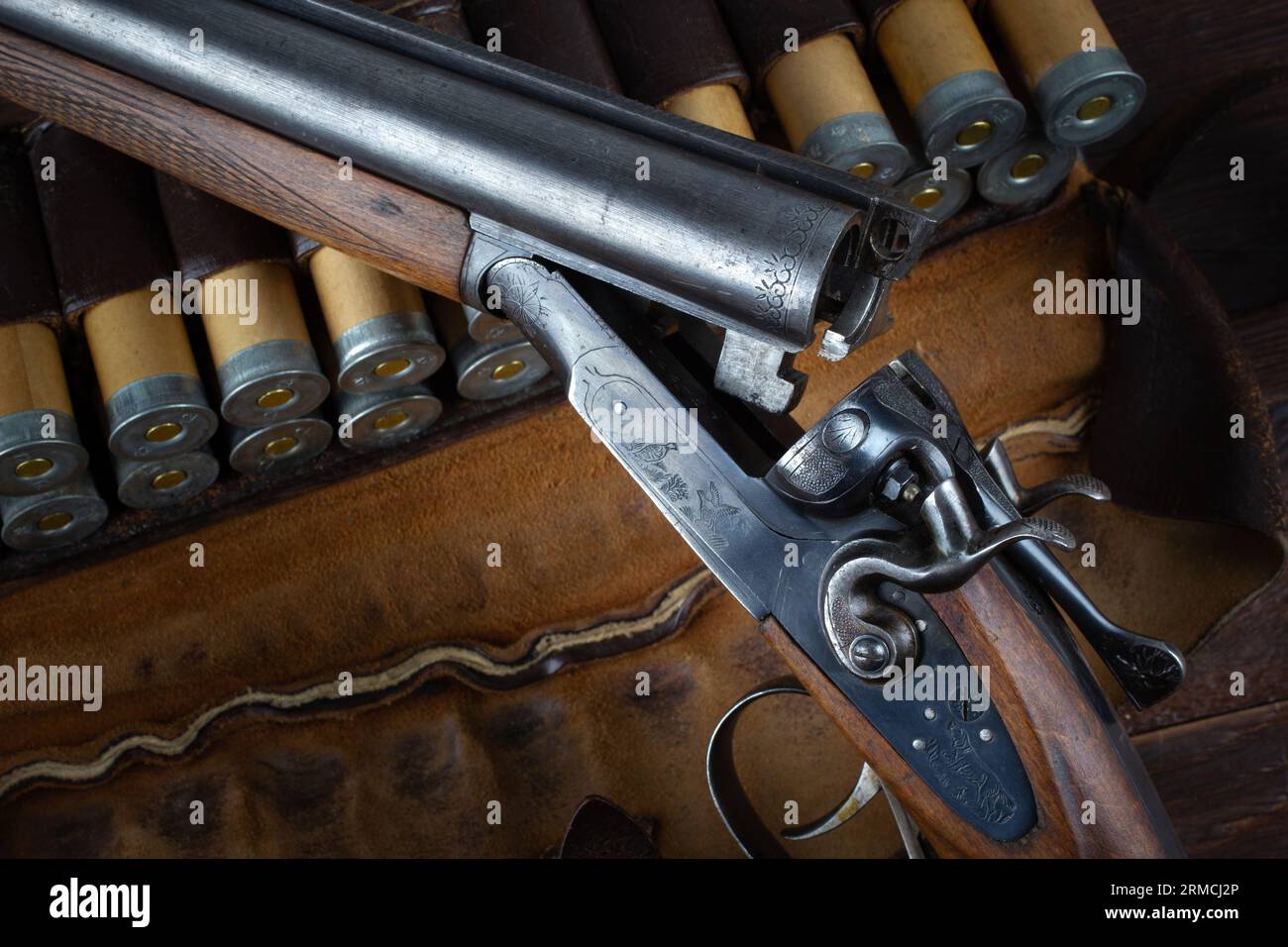 Antique 12-gauge break-action smooth-bored shotgun with paper cases on ...