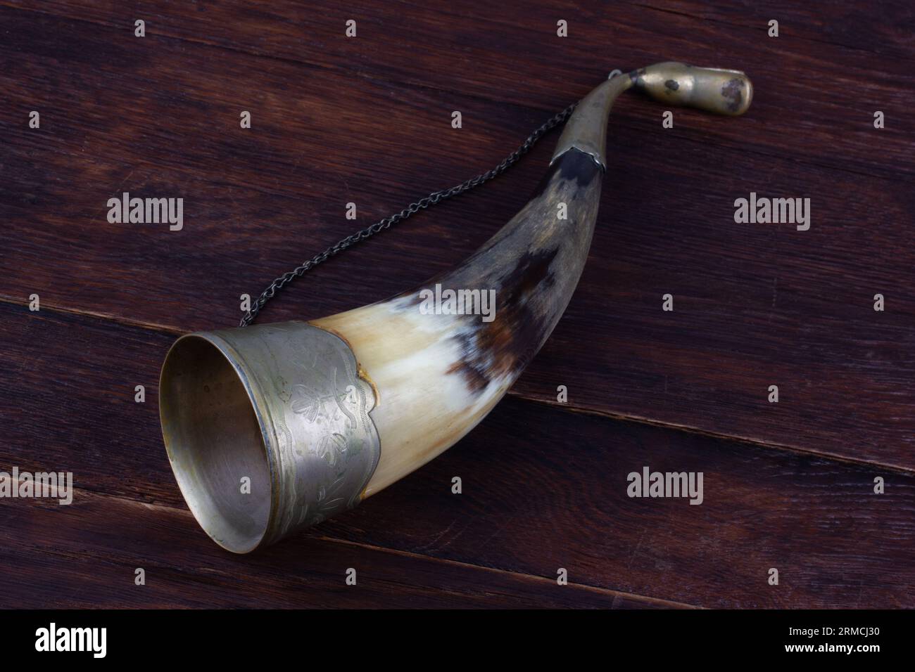 traditional horn for liquor on wooden background Stock Photo - Alamy