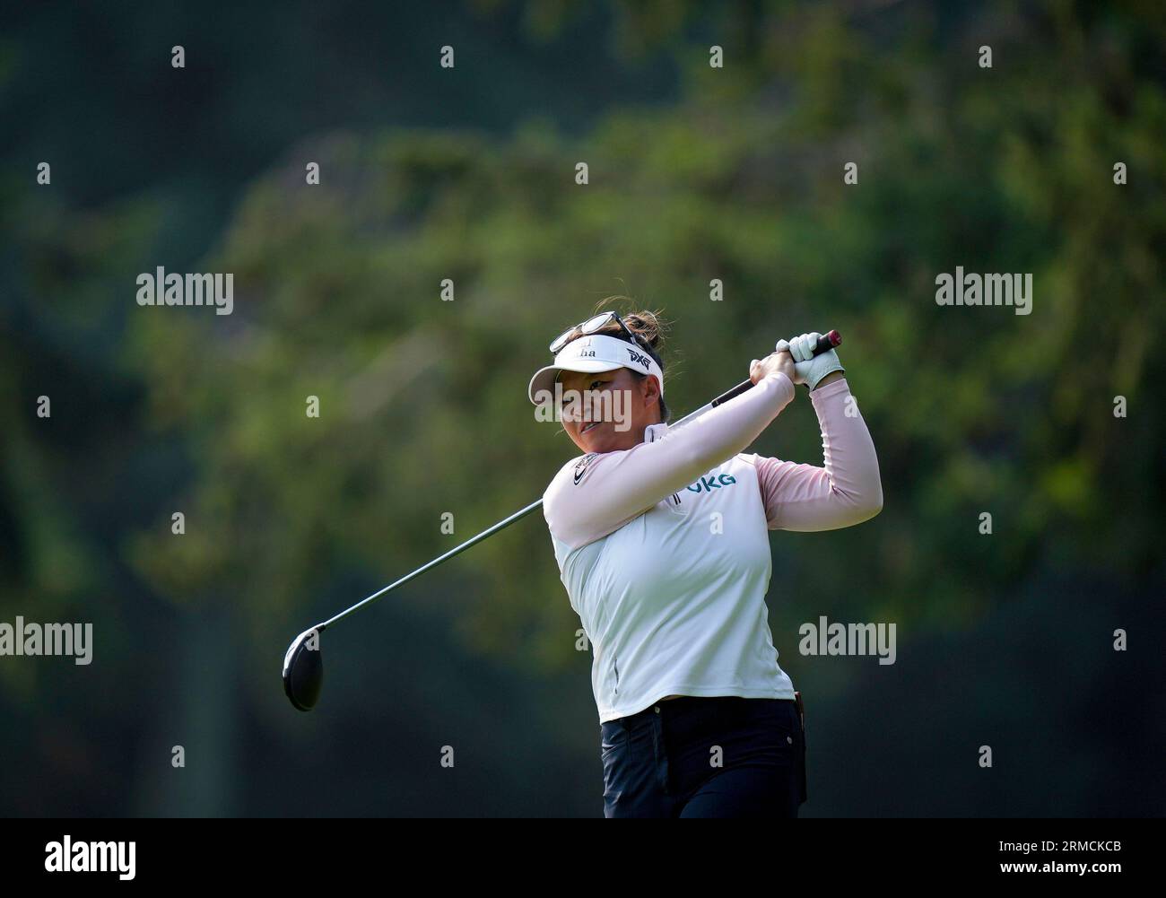 Megan Khang, of the United States, watches her tee shot on the seventh ...