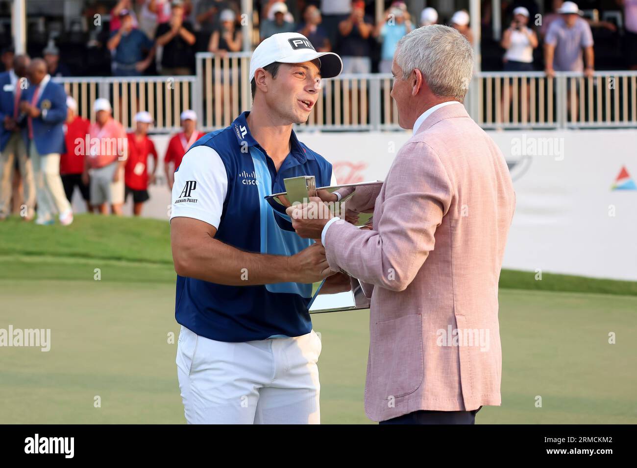 ATLANTA, GA - AUGUST 27: Viktor Hovland accepts the trophy from PGA ...