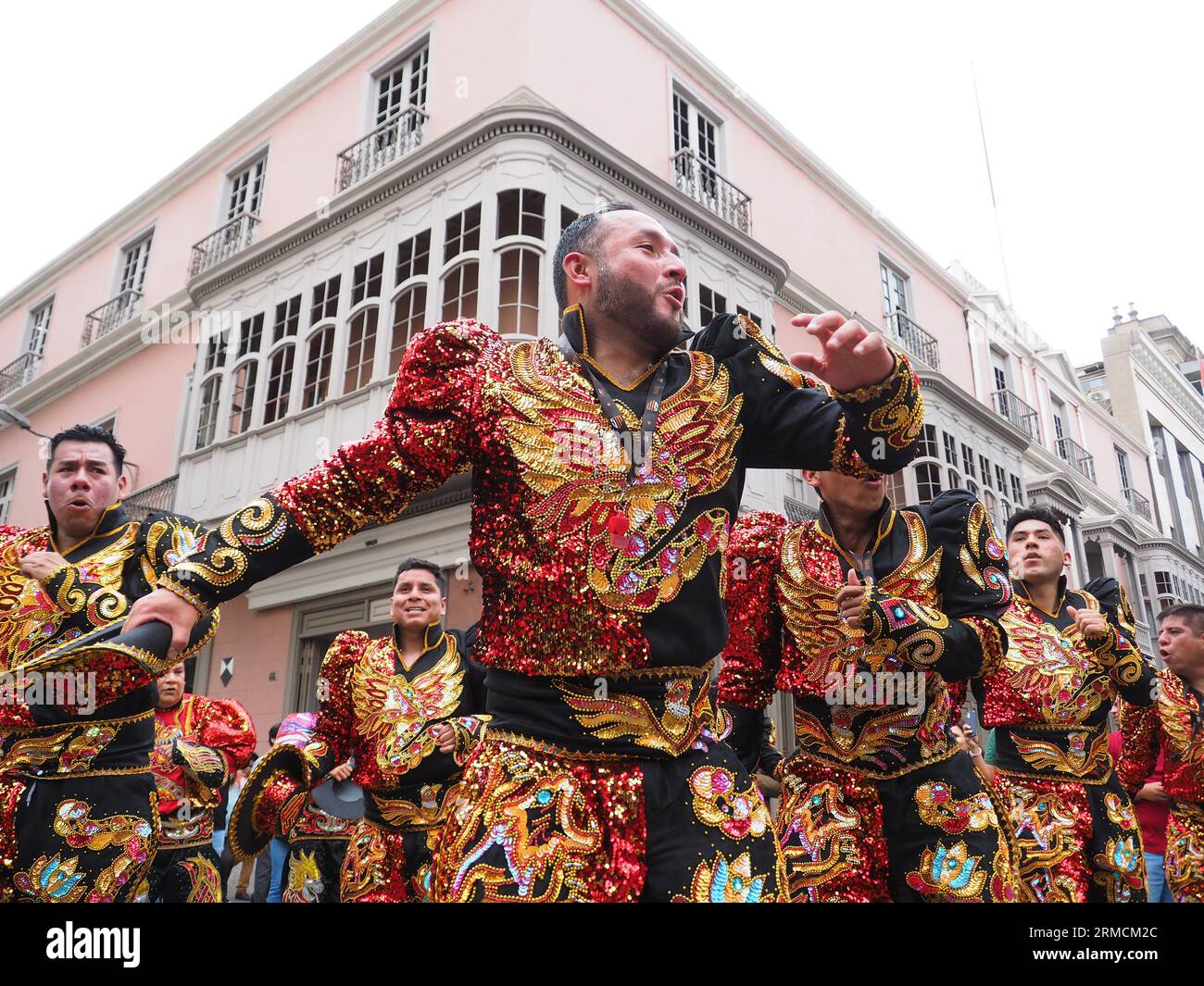 Troupe of dancers performing and wearing traditional costumes from ...