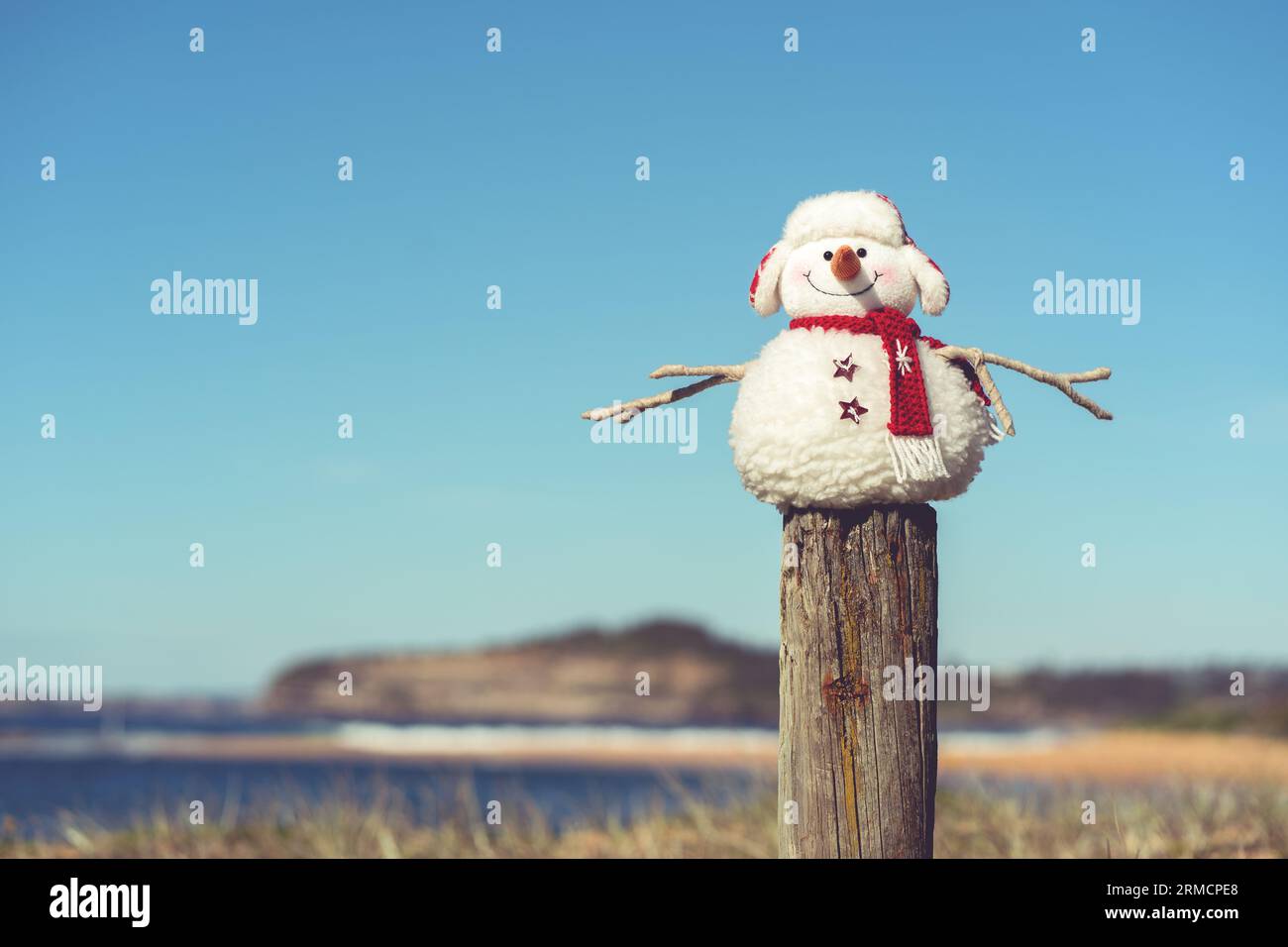 Snowman on the beach Stock Photo - Alamy