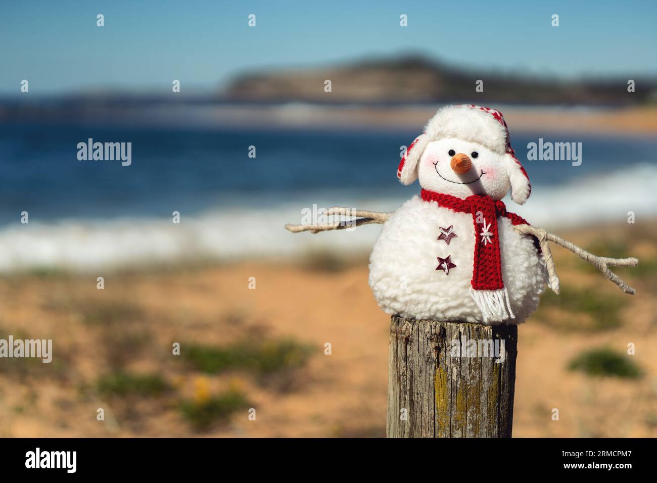Snowman on the beach Stock Photo - Alamy
