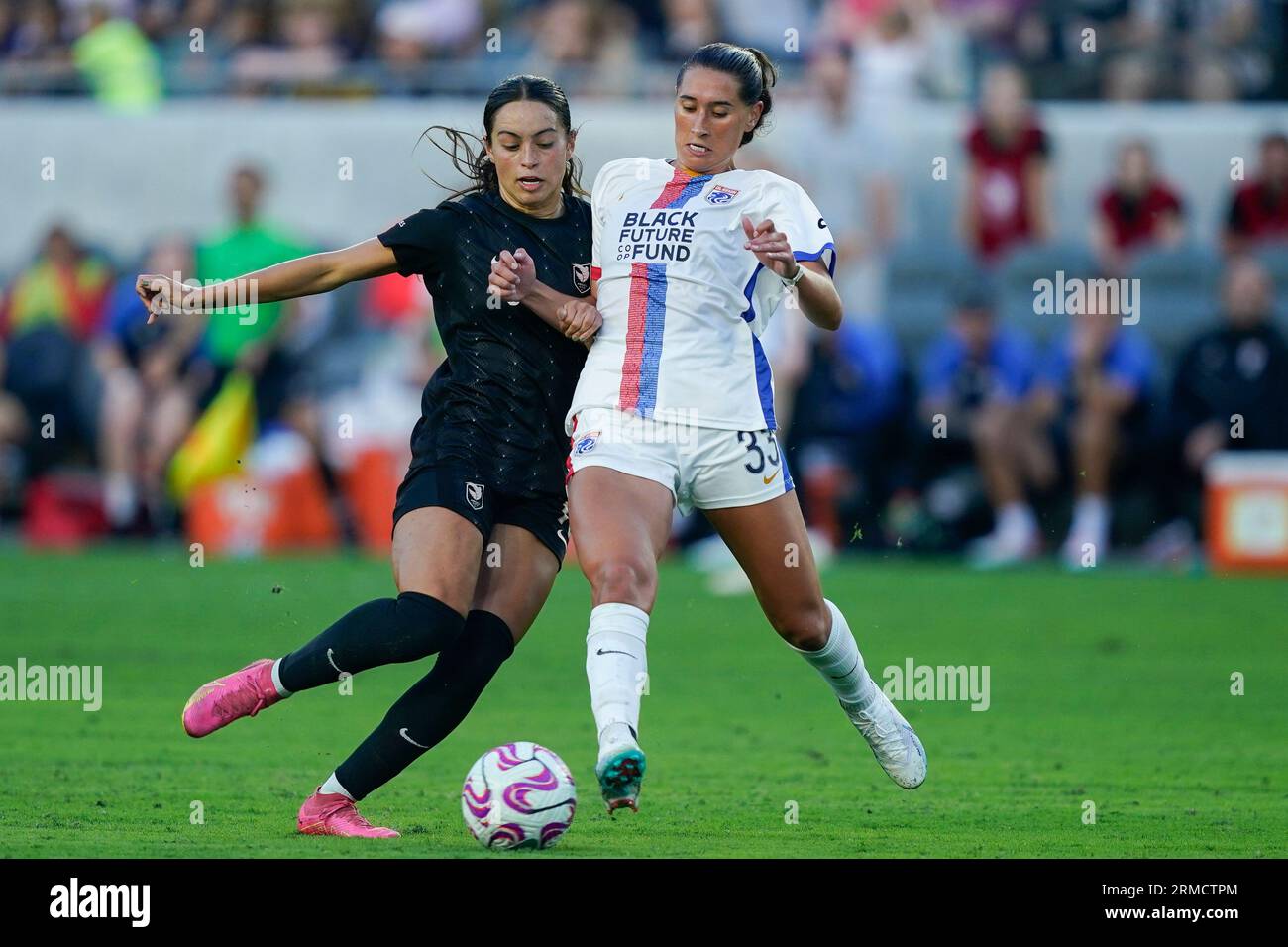 Angel City FC forward Scarlett Camberos, left, and OL Reign midfielder ...