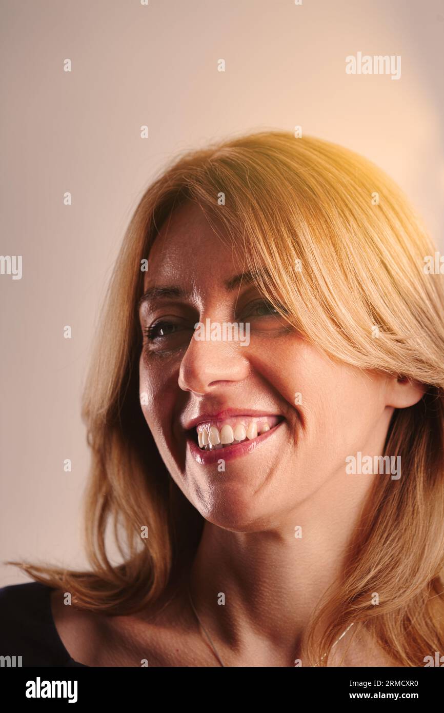 With a heart full of contentment, a woman beams, valuing her life and ...