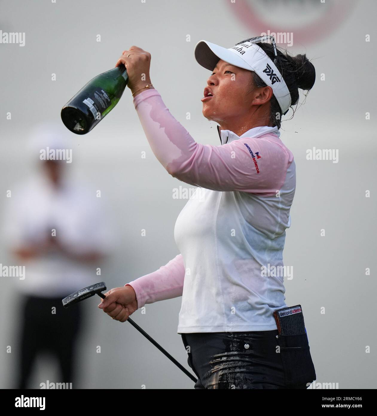 Vancouver, Canada. 27th Aug, 2023. Megan Khang, of the U.S., drinks champagne after winning the ...