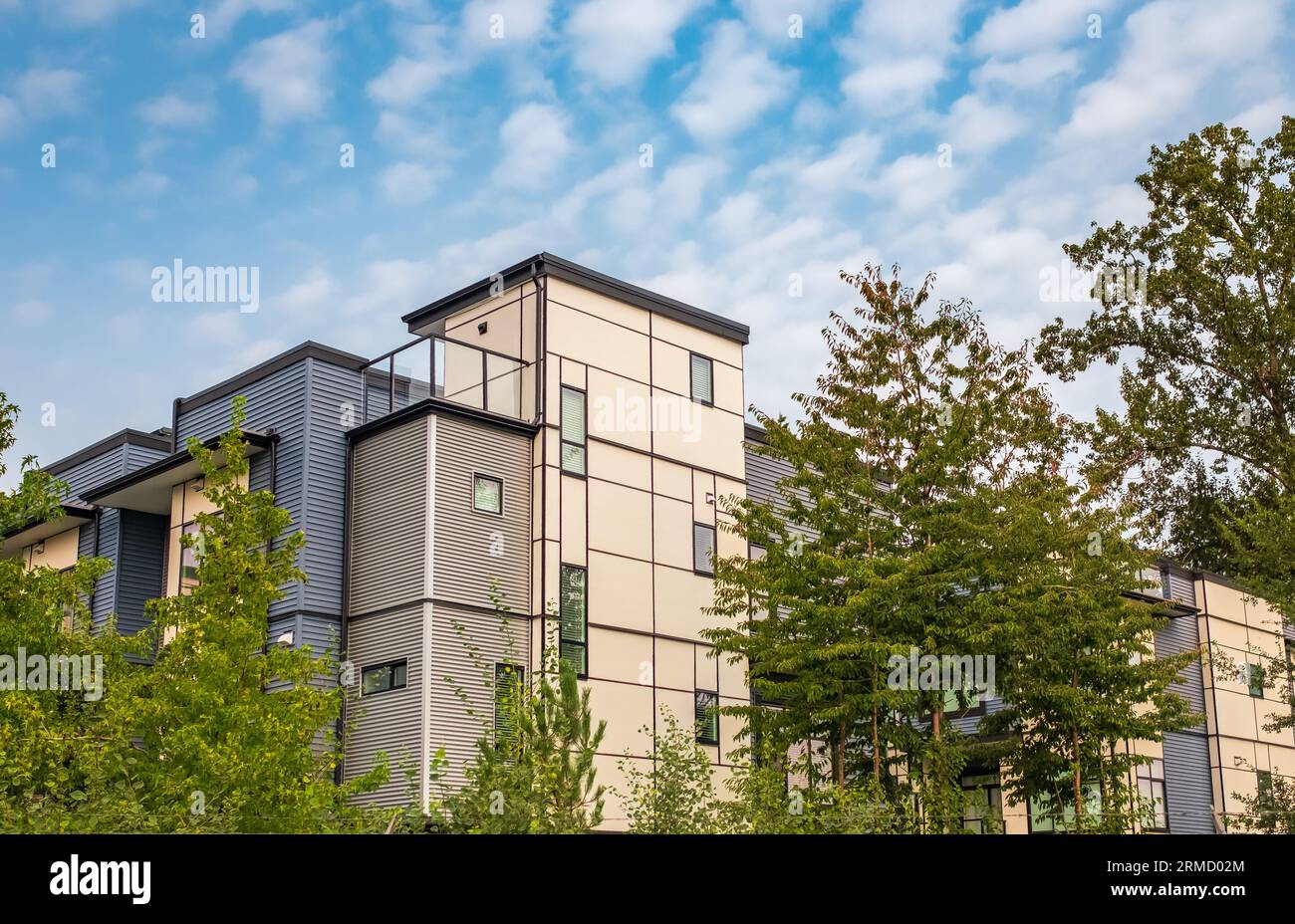 Brand new apartment building on sunny day in BC, Canada. Canadian ...
