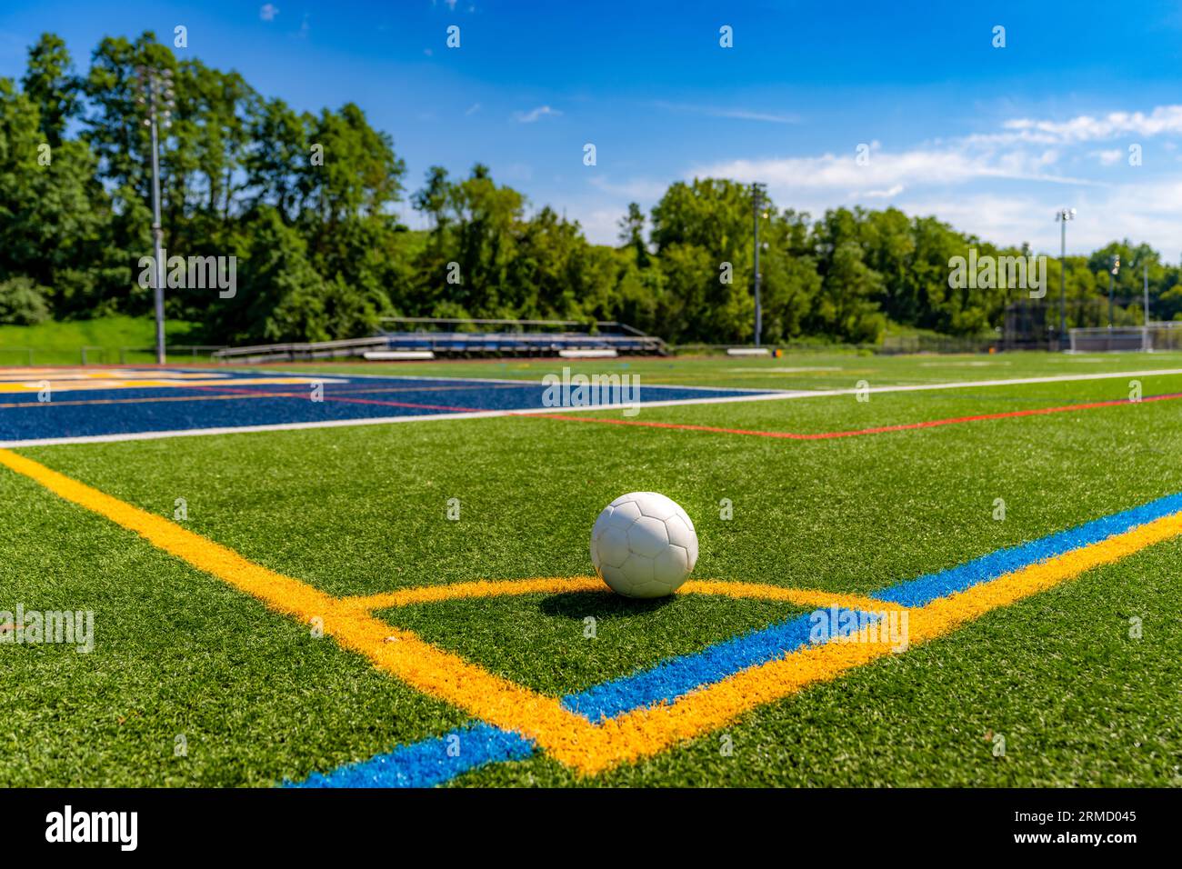 Afternoon photo of a white American soccer ball at the corner of a ...