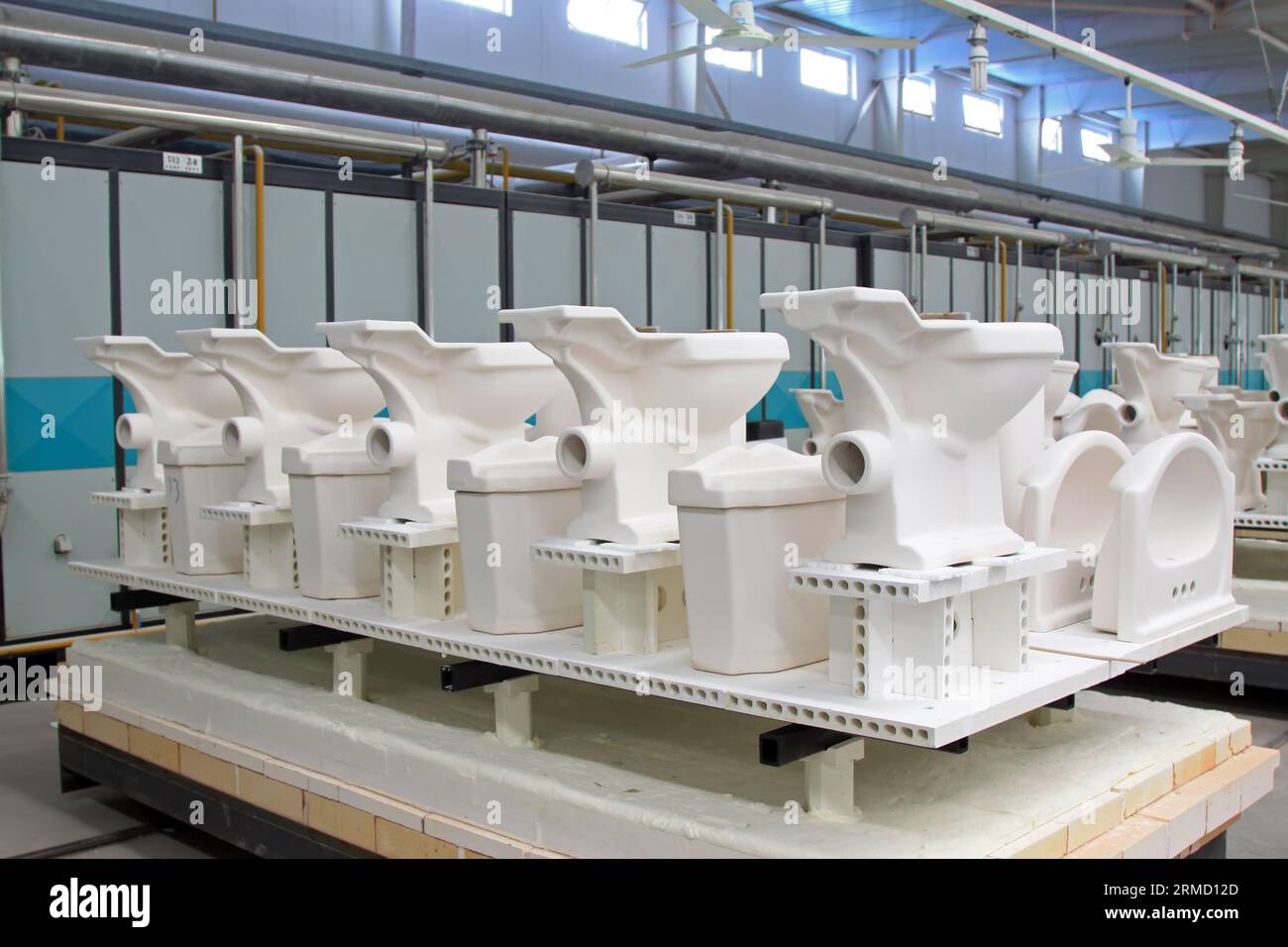 Ceramic toilet products, in a workshop production line Stock Photo - Alamy