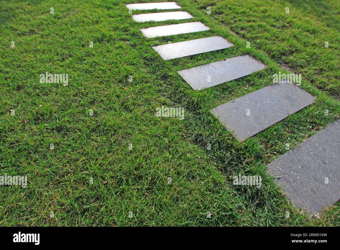 A flagstone walkway in a park Stock Photo - Alamy