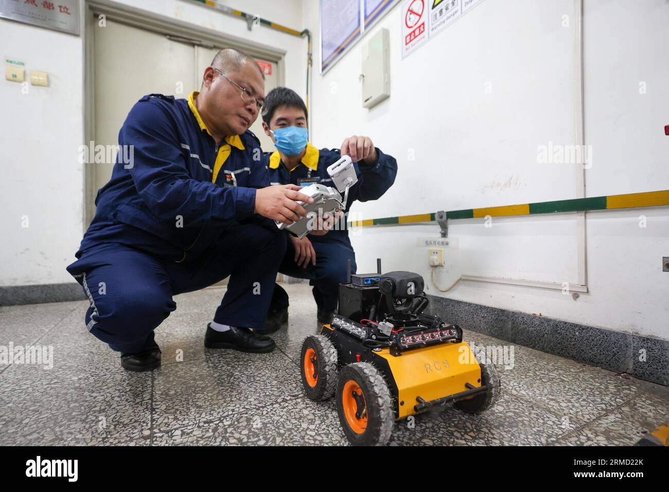**CHINESE MAINLAND, HONG KONG, MACAU AND TAIWAN OUT** Workers use an intelligent inspection ...
