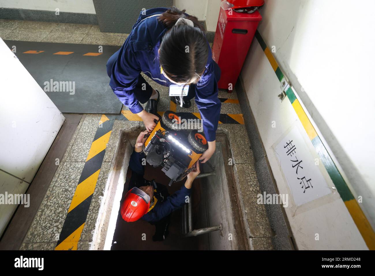 **CHINESE MAINLAND, HONG KONG, MACAU AND TAIWAN OUT** A worker uses an ...