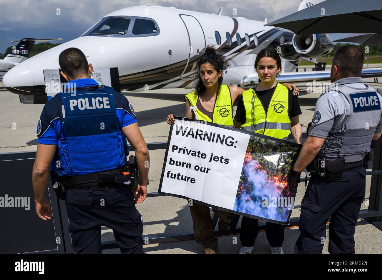 FILE - Environmental activists of Stay Grounded and Greenpeace protest ...