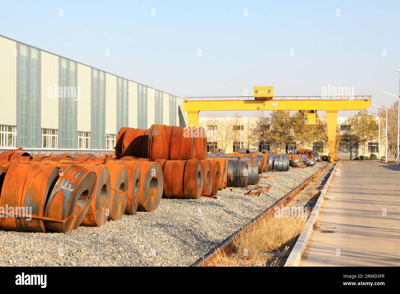 raw materials strip steel and crane, in a material field Stock Photo ...