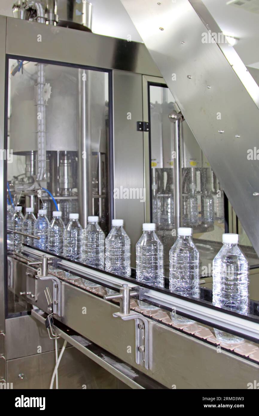 bottled mineral water production line in a factory Stock Photo - Alamy