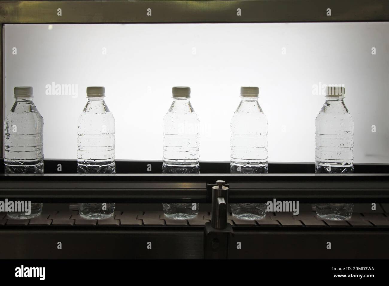 bottled mineral water production line in a factory Stock Photo - Alamy