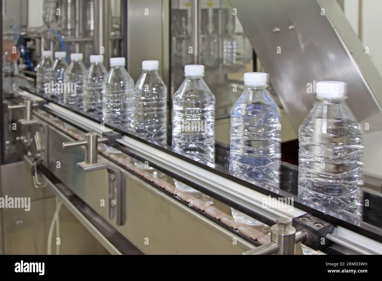 bottled mineral water production line in a factory Stock Photo - Alamy