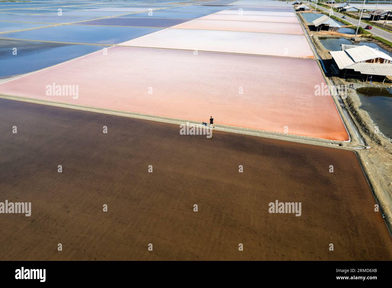 Aerial photo of person walking in salt flats textures in Phetchaburi ...