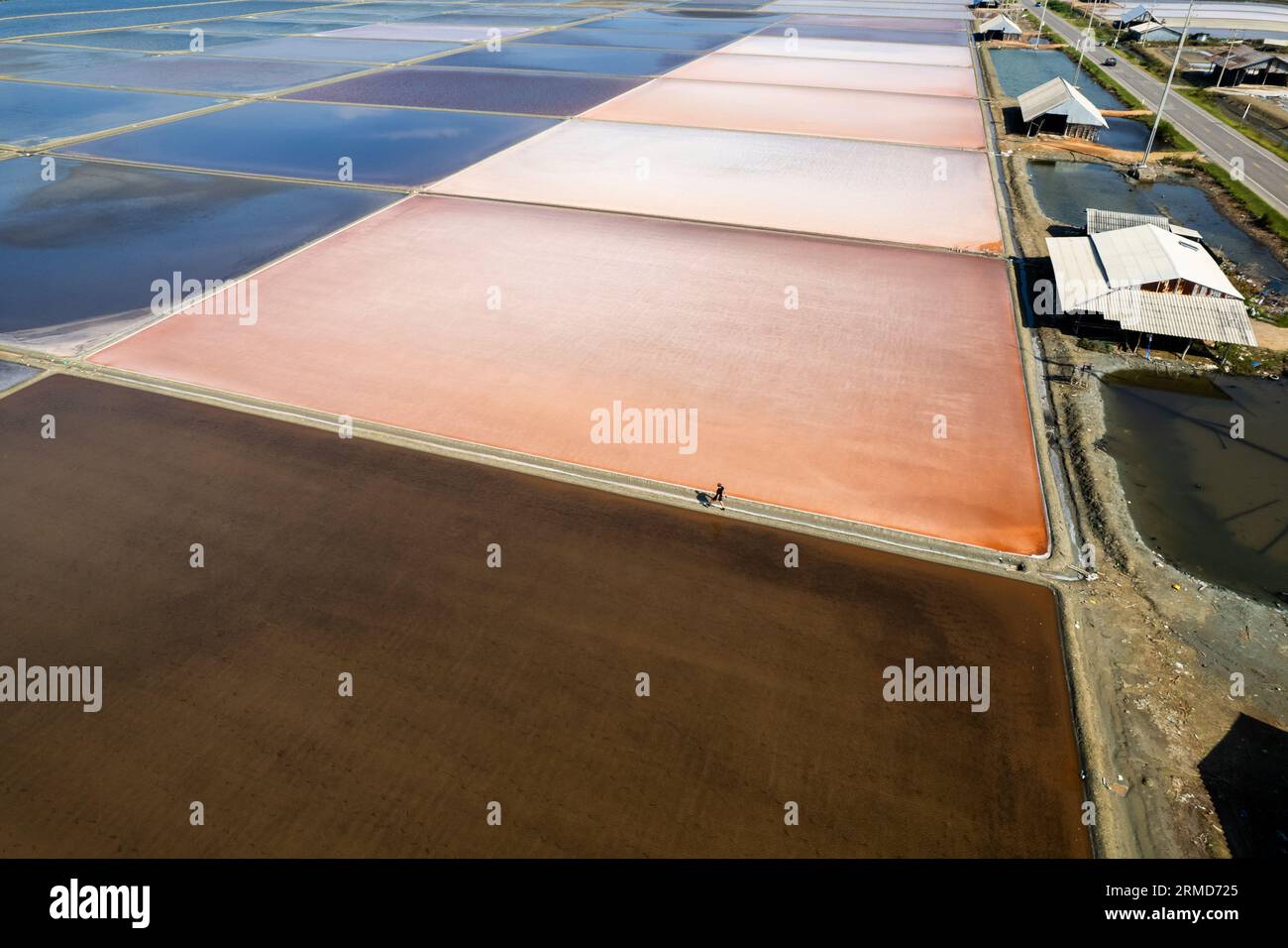 Aerial photo of person walking in salt flats textures in Phetchaburi ...