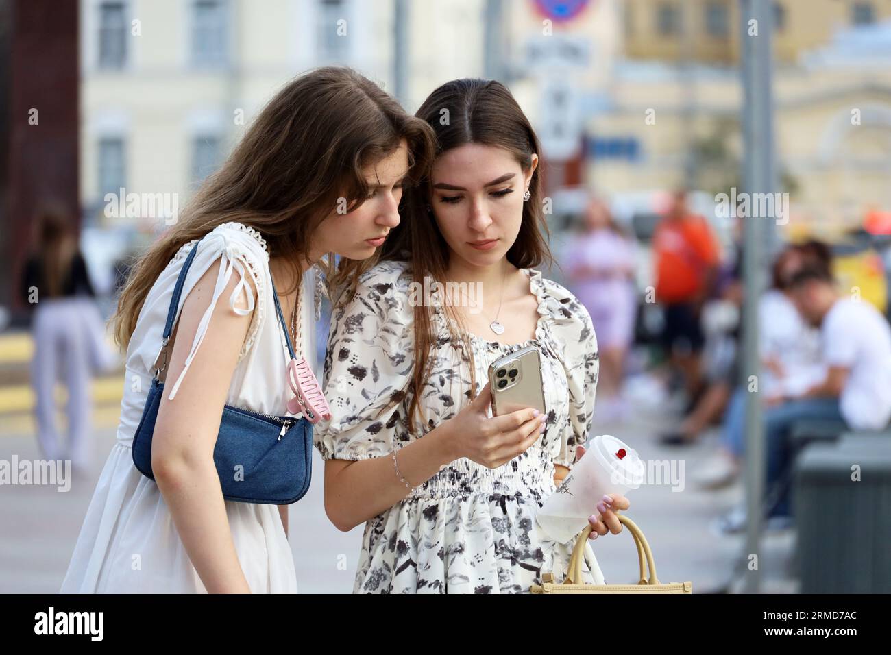 Two girls looking at screen hi-res stock photography and images - Alamy
