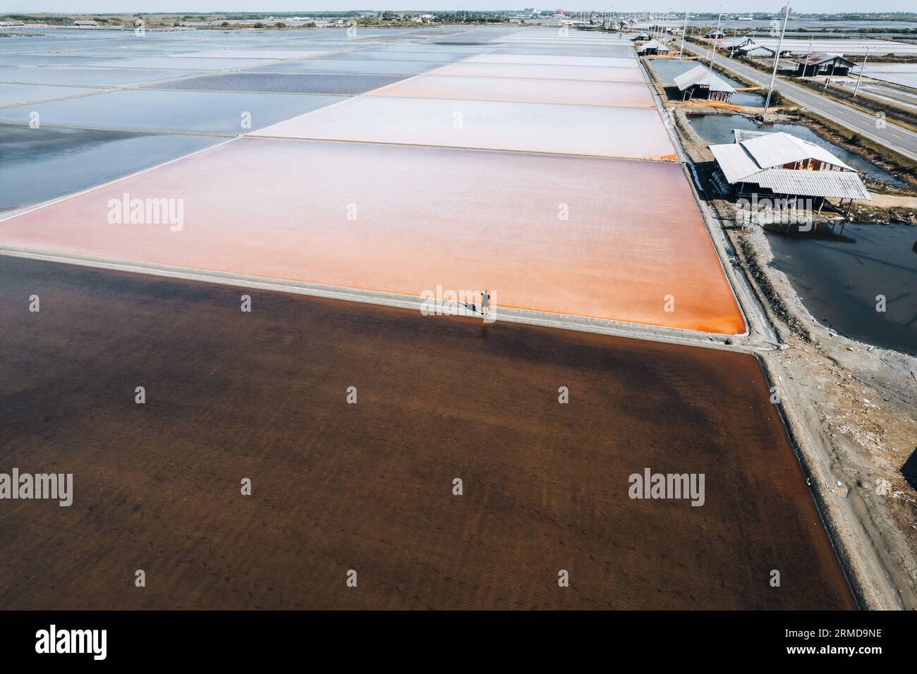 Aerial photo of person walking in salt flats textures in Phetchaburi ...
