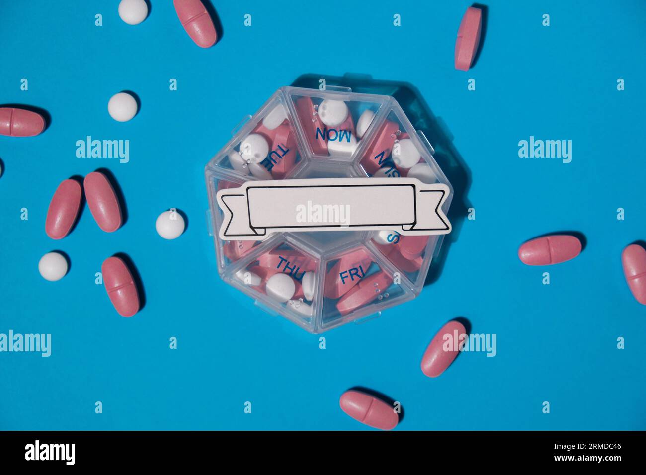 Closeup of medical pill box with doses of tablets for daily take ...