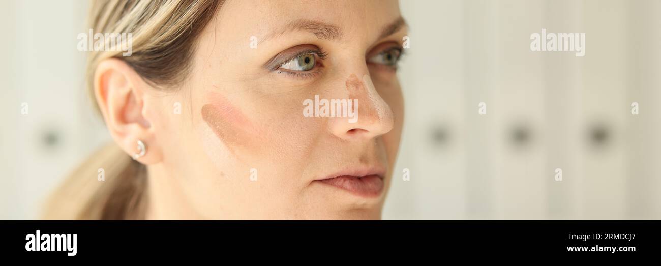A close-up on the female face of a tonal cream smear Stock Photo - Alamy