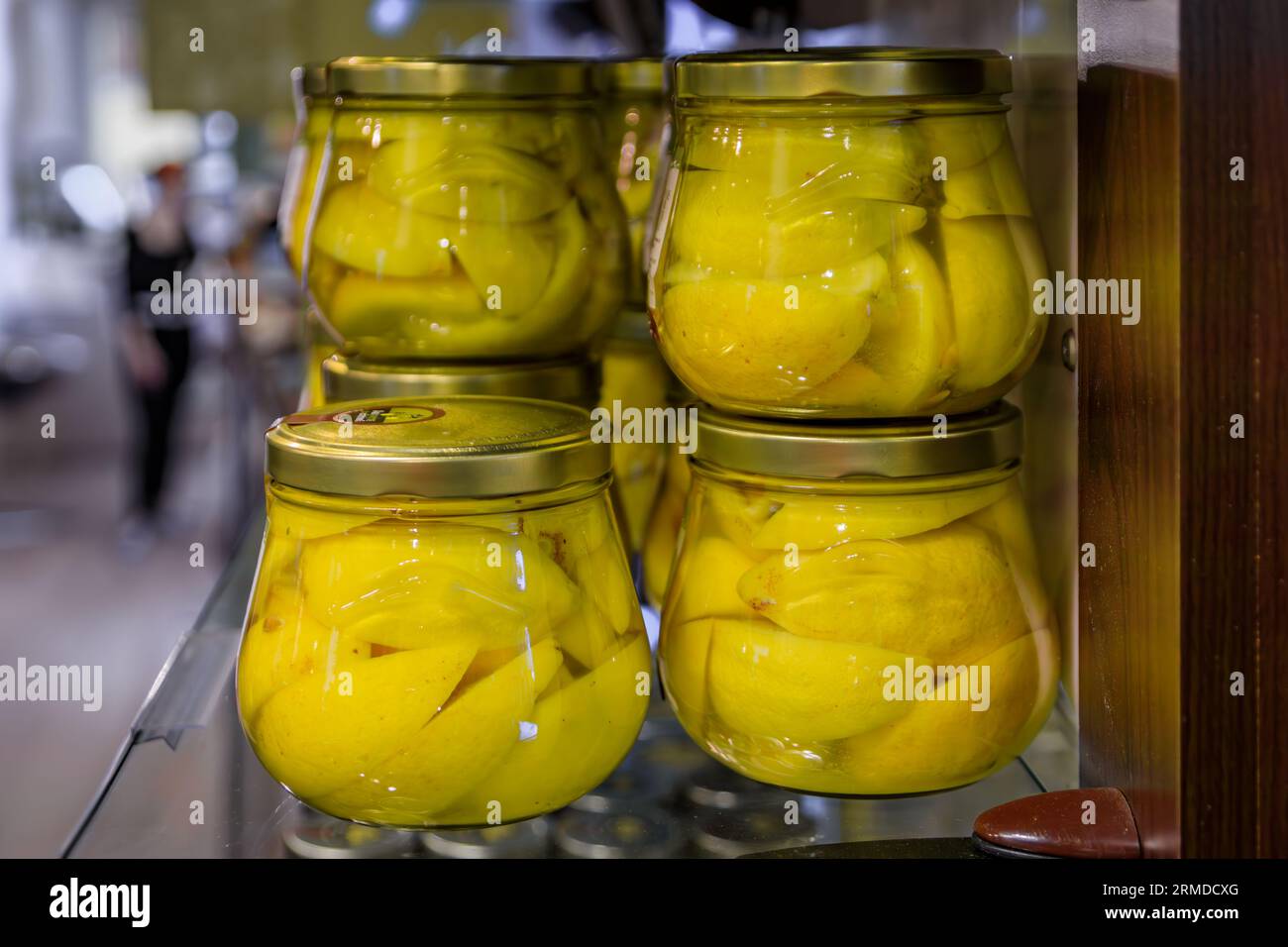 Yellow local lemon confit preserved in jars on display for sale at an ...