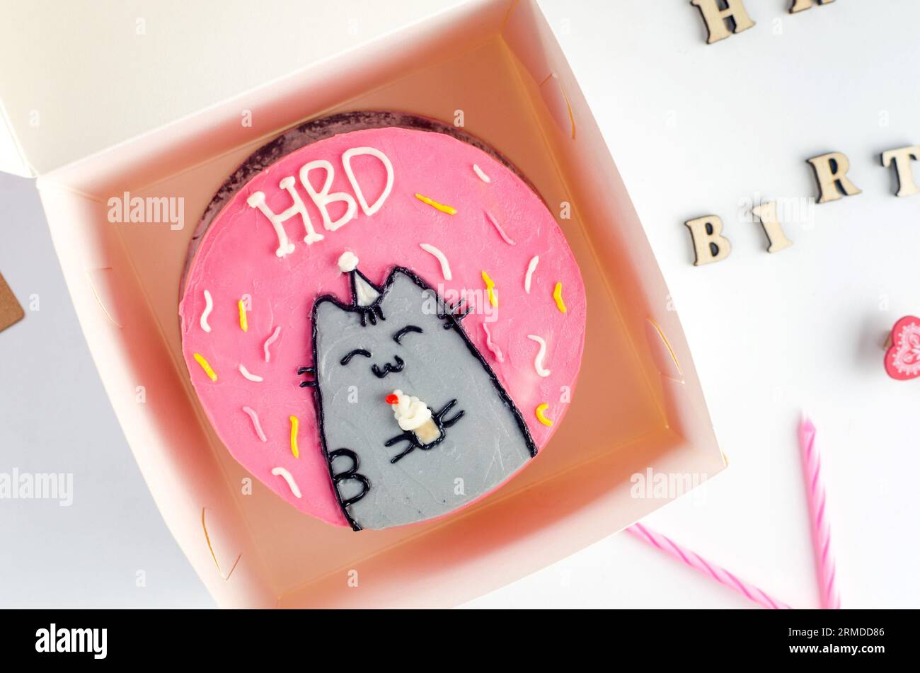 Trendy bento cake pink color with cute decor on light background. Cake ...