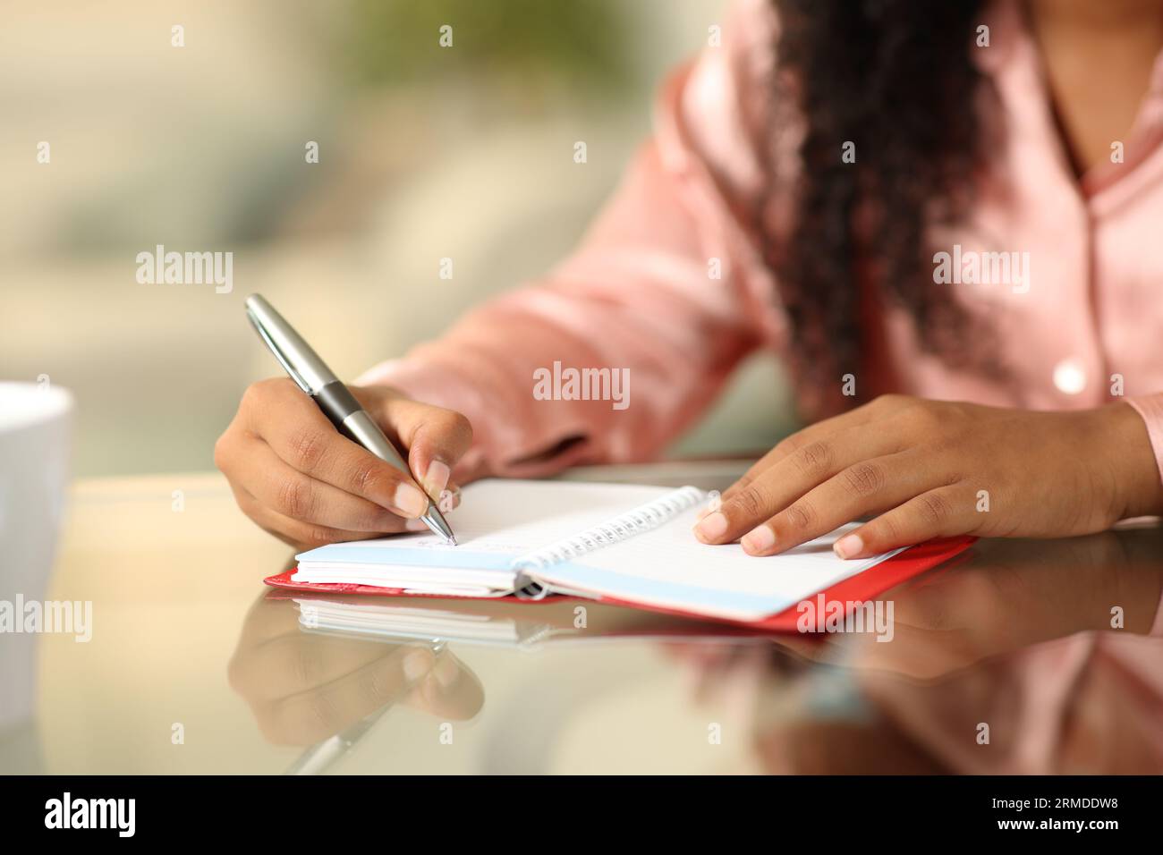 Black lady writing hi-res stock photography and images - Alamy