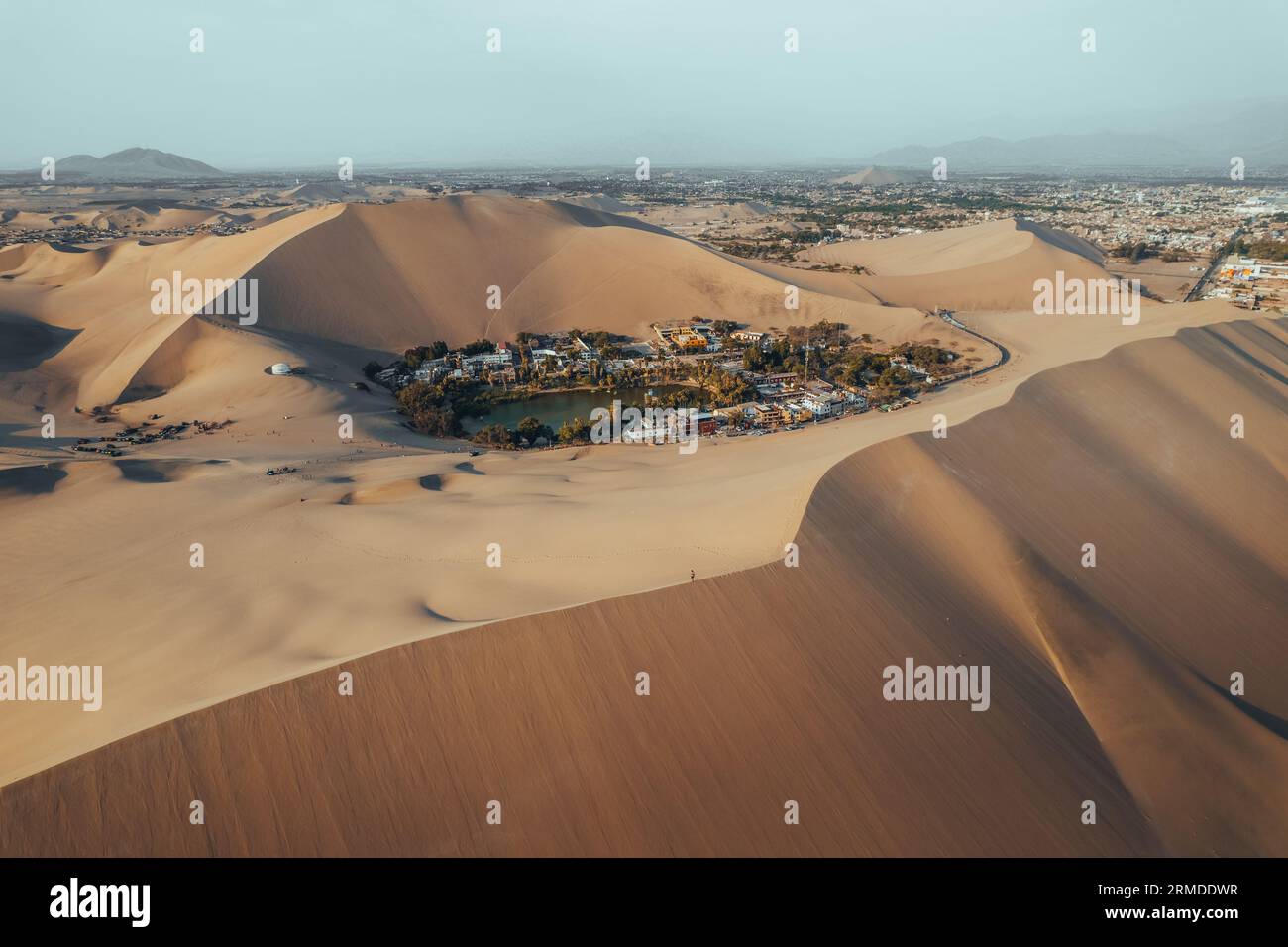 Aerial sunset photo of desert oasis Huacachina, Ica, Peru, South ...