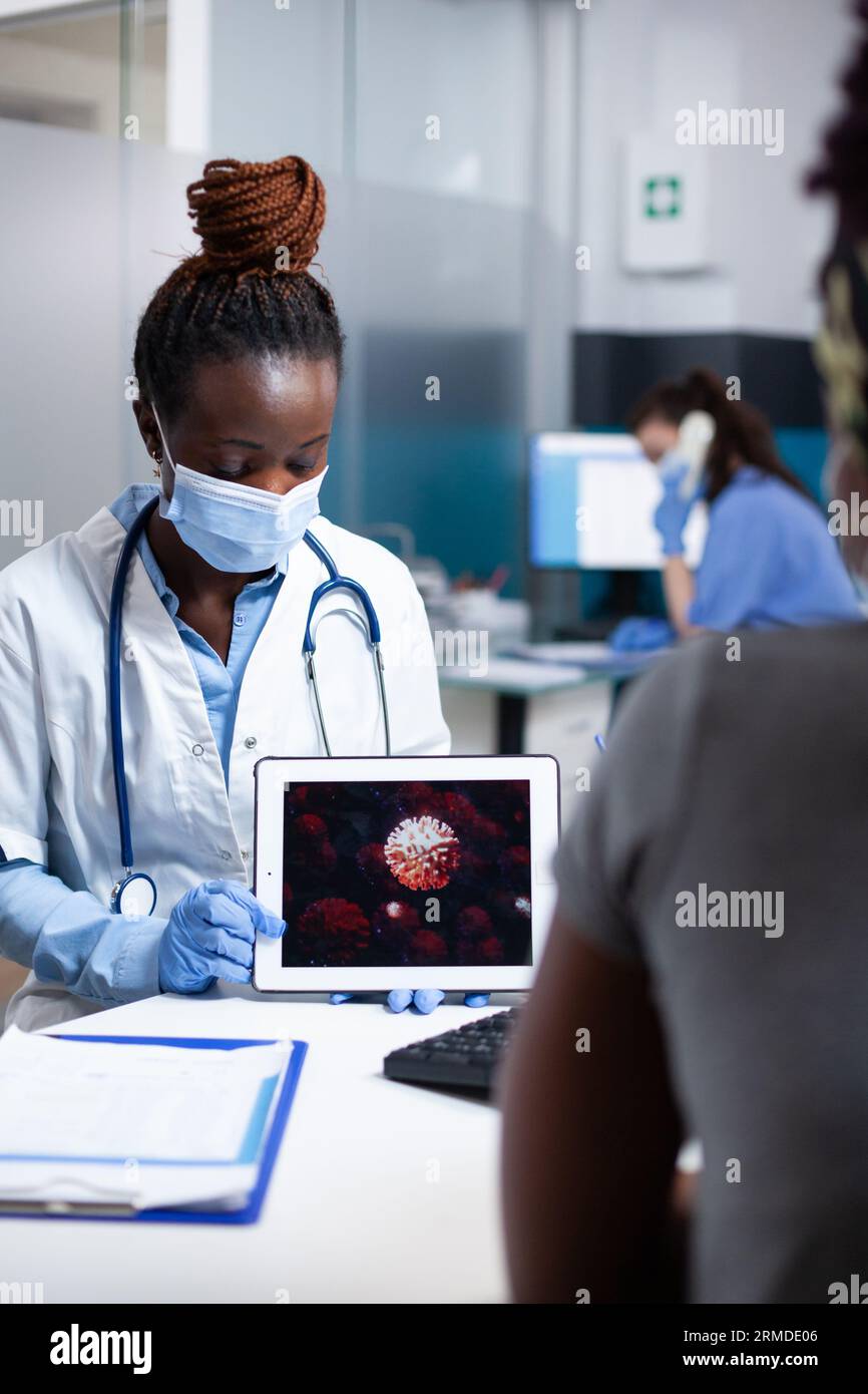 Microbiology doctor teaching patient about disease preventative ...